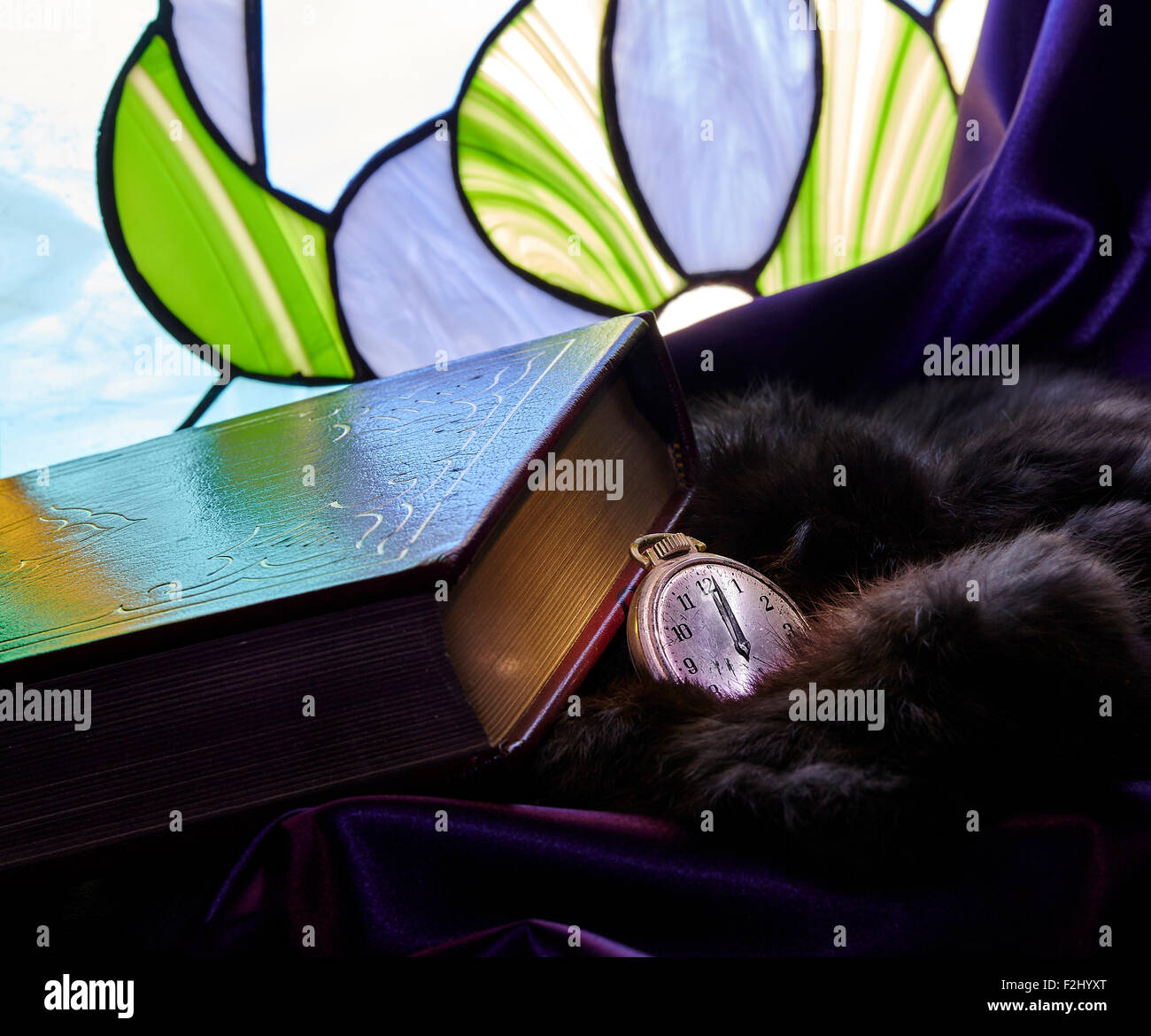 Ancient Book of Sacred Time with Watch Clock and Stained Glass Stock ...