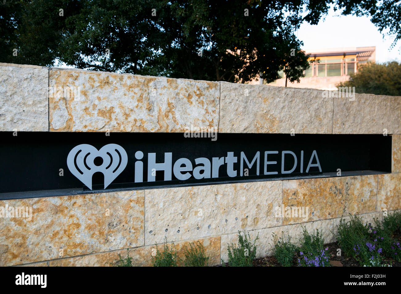 A logo sign outside of the headquarters of iHeartMedia, Inc., in San ...