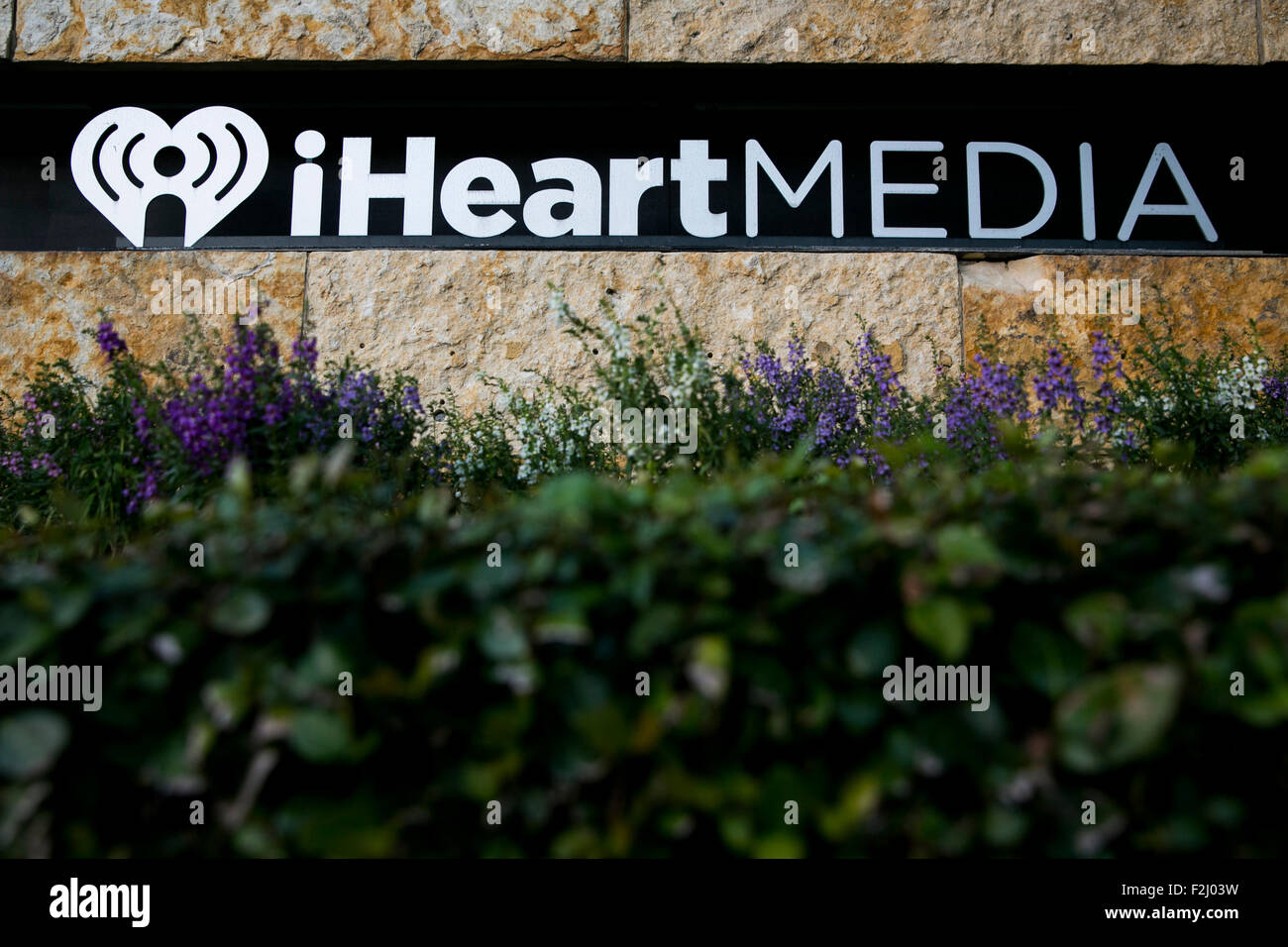 A logo sign outside of the headquarters of iHeartMedia, Inc., in San ...