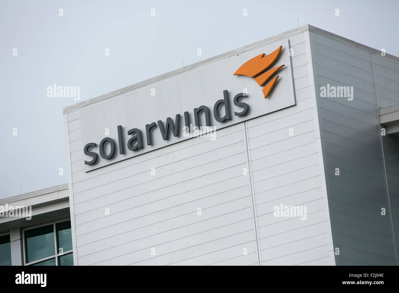 A logo sign outside of the headquarters of SolarWinds Inc., in Austin ...