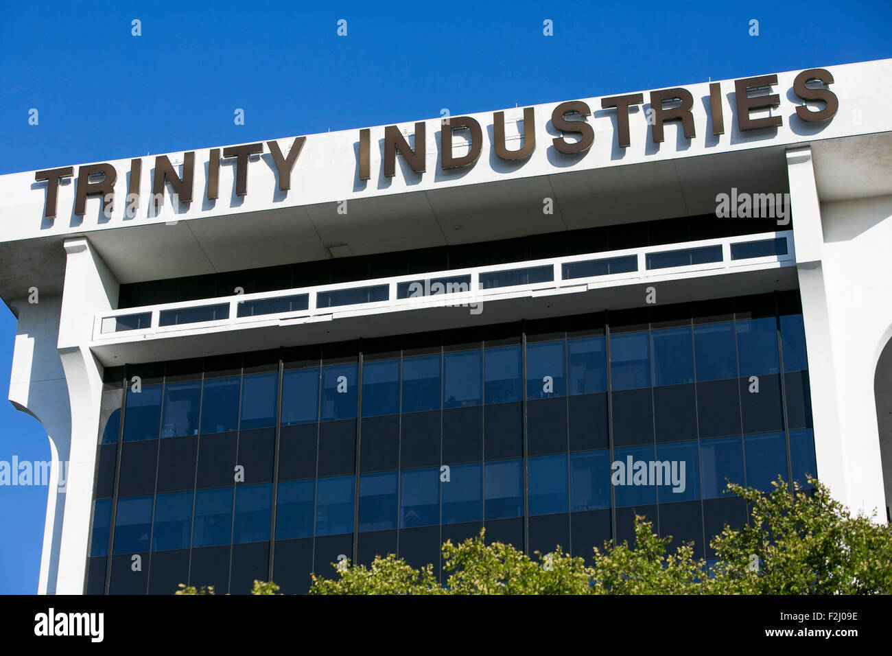 A logo sign outside of the headquarters of Trinity Industries Inc., in ...