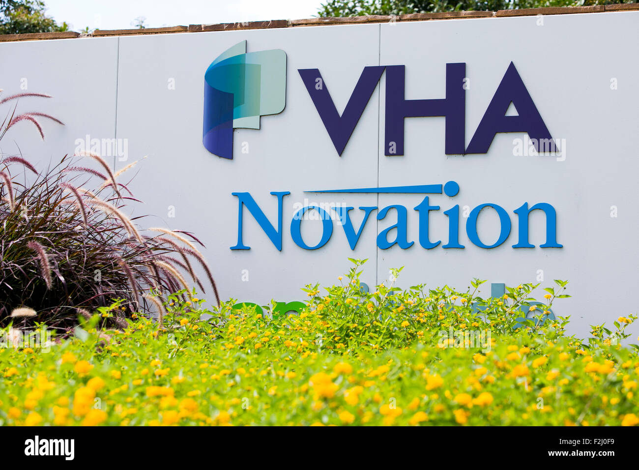 A logo sign outside of the headquarters of VHA, Inc., the parent ...