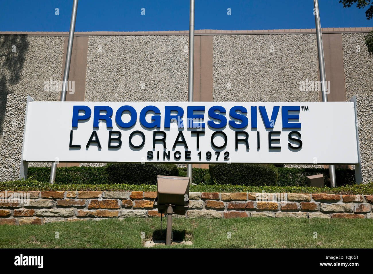 A logo sign outside the headquarters of Progressive Laboratories, Inc ...