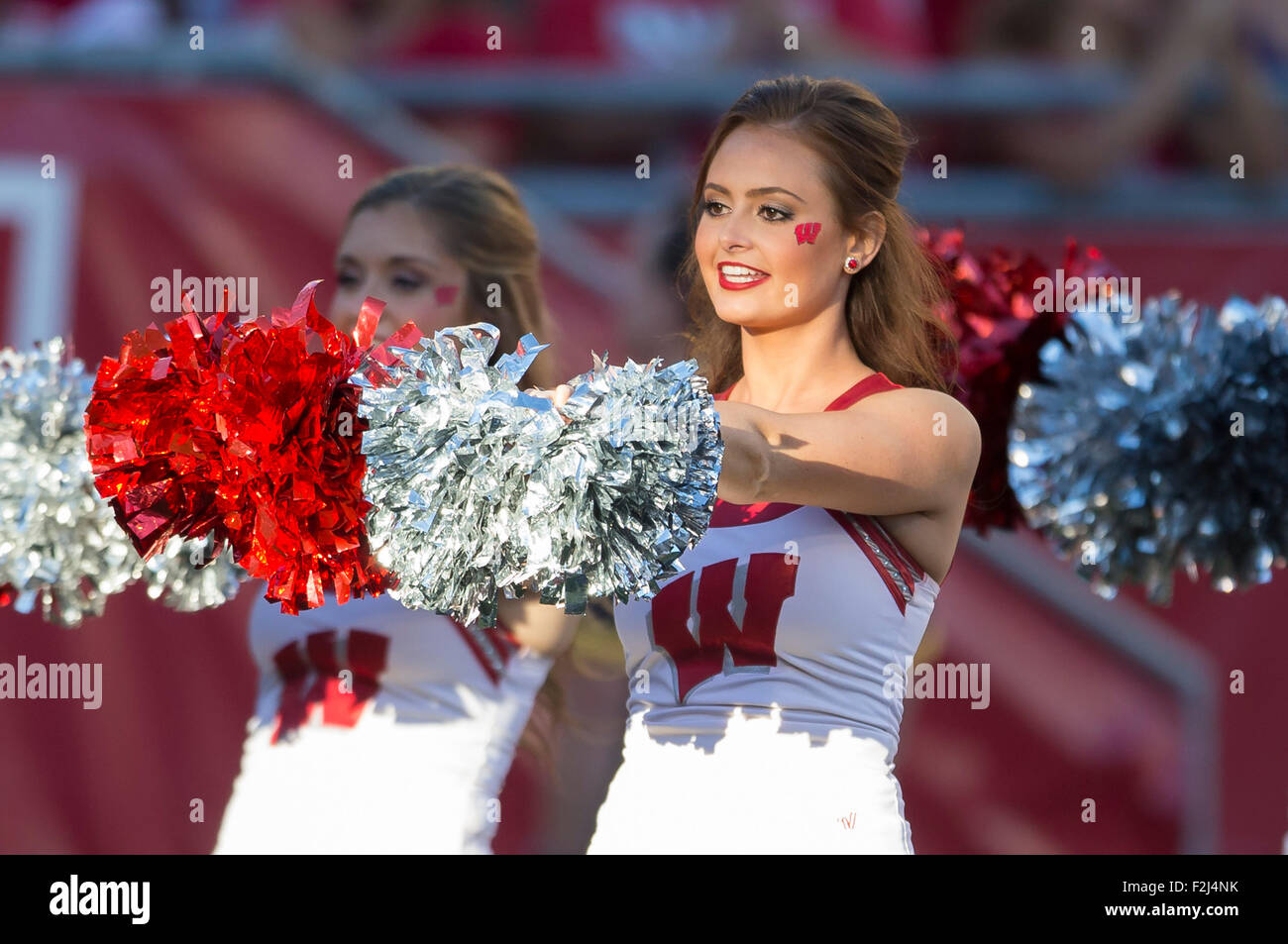 Madison, WI., USA. 19 September, 2015. Wisconsin cheerleader entertains ...