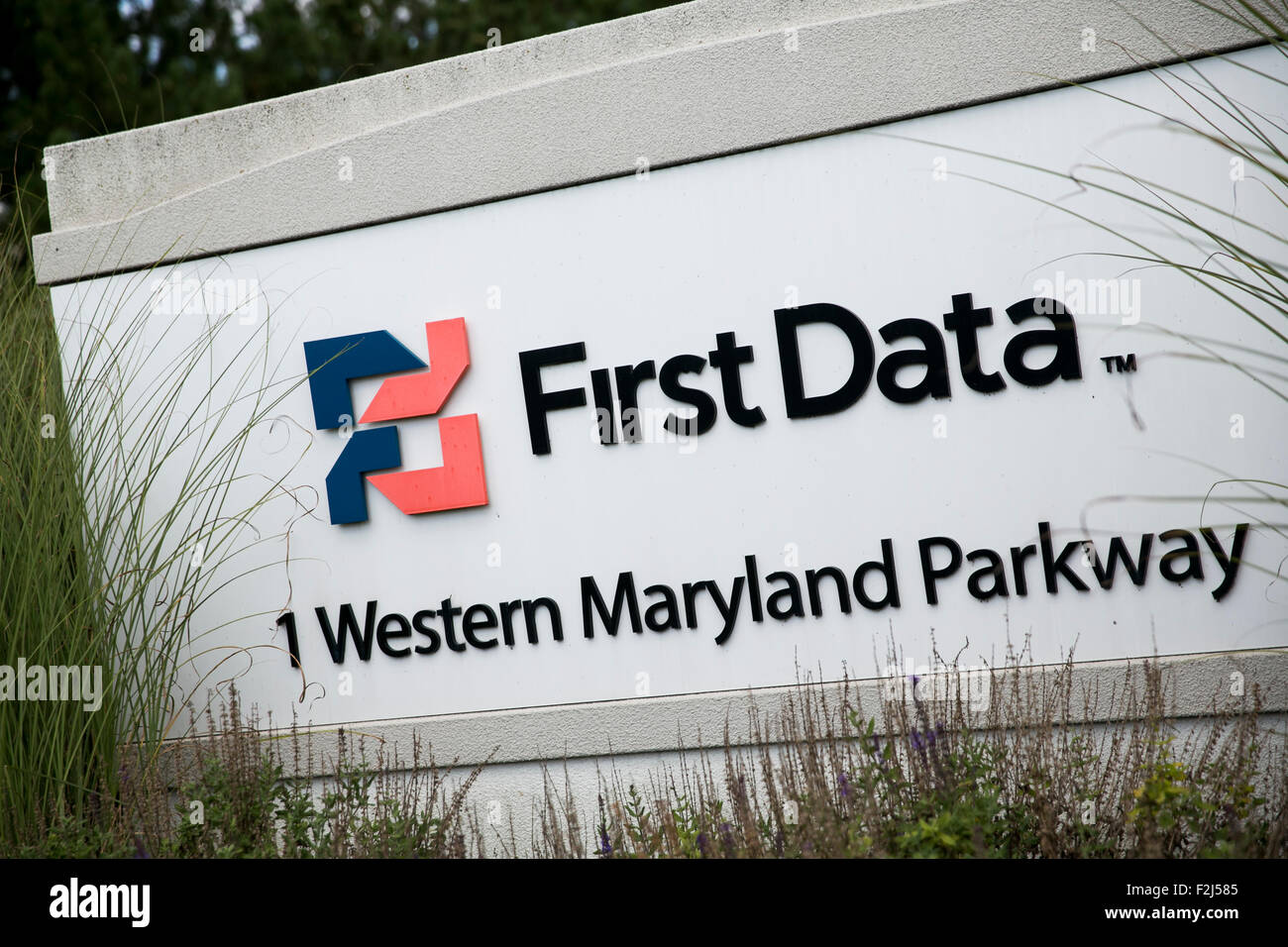 A logo sign outside of a facility occupied by payments processor First ...