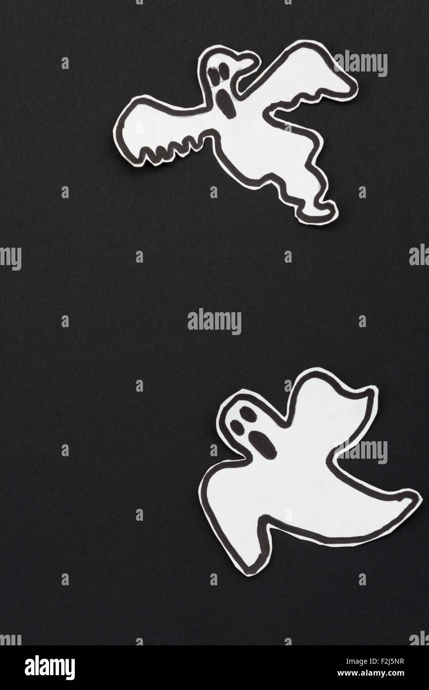 a overhead view of a scene of drawing halloween decorations: ghosts ...