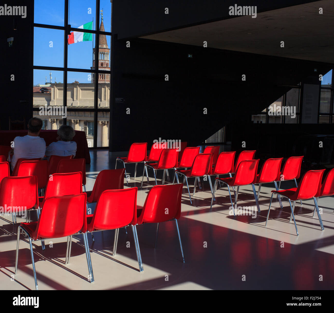 Many red plastic chairs hi-res stock photography and images - Alamy
