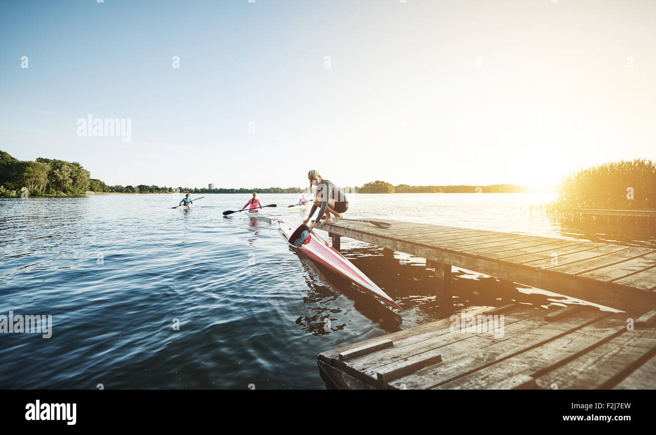 Elite sports rowing team getting ready to row Stock Photo - Alamy