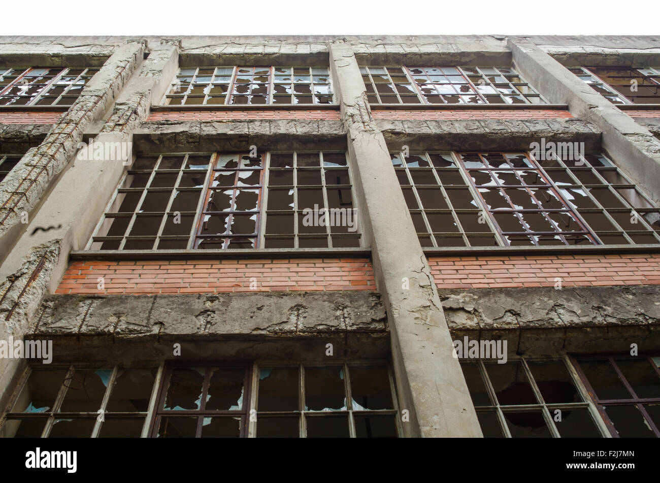 View of broken windows of abandoned building Stock Photo - Alamy