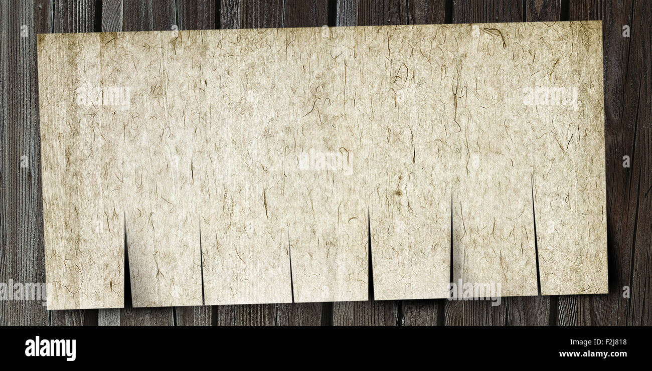 Tear off paper notice on the wood Stock Photo - Alamy