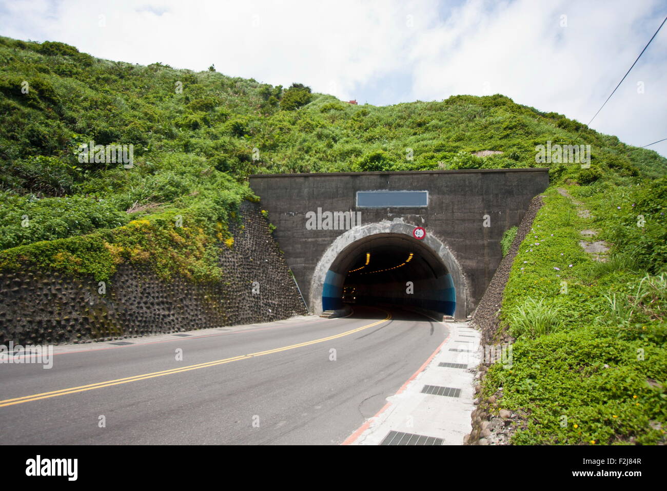 view of road tunnel along seaside,Taiwan Stock Photo - Alamy