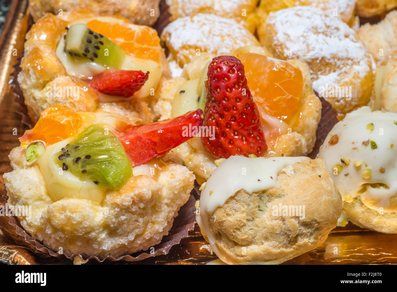 colorful pastries with fruits, cream and chocolate, the real Italian ...