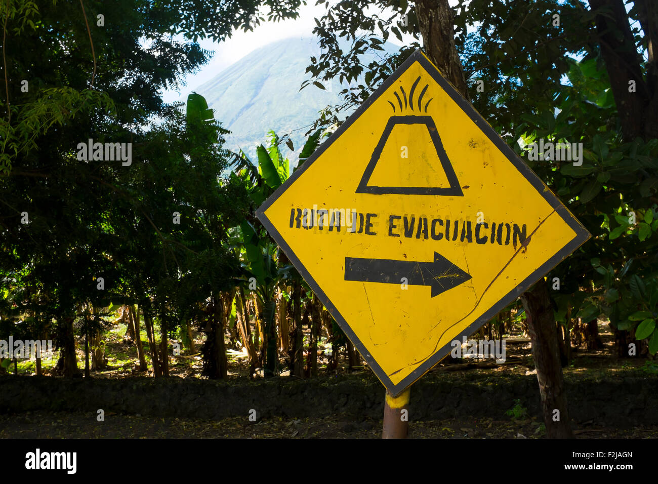 A crude sign directing towards a volcano evacuation route on the Island ...