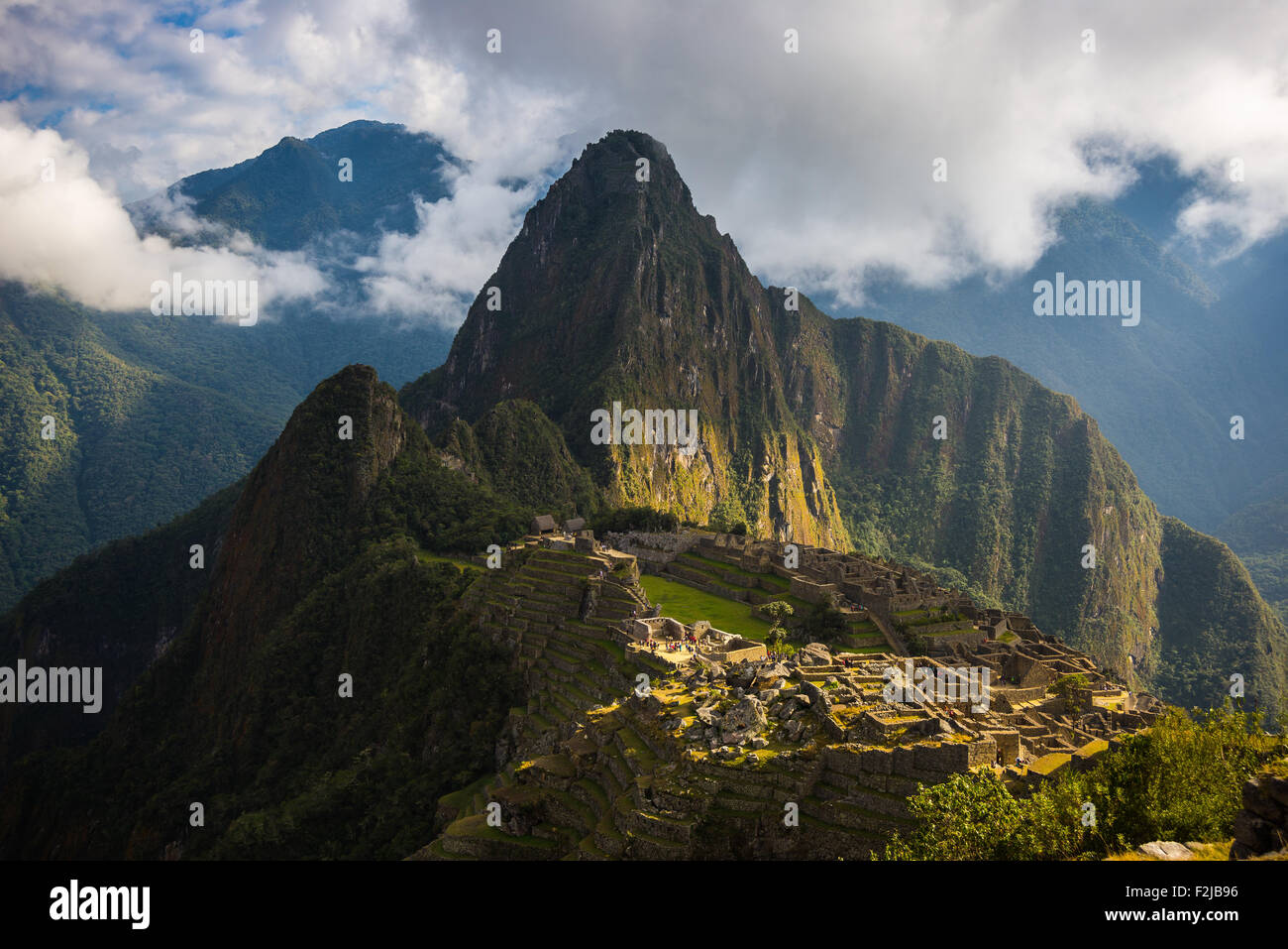 Machu Picchu illuminated by the first sunlight coming out from the ...