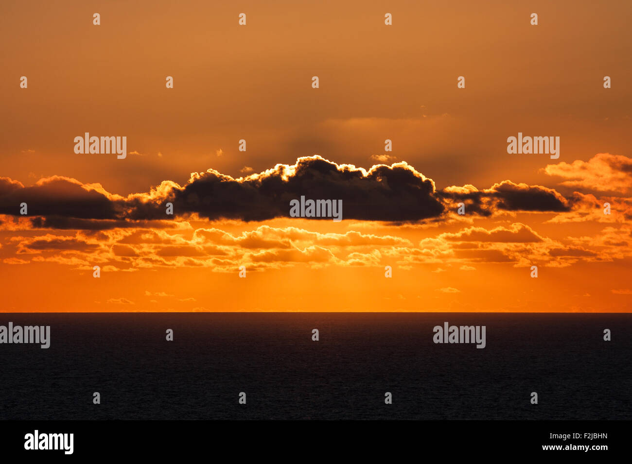 Sunset over the sea Stock Photo - Alamy