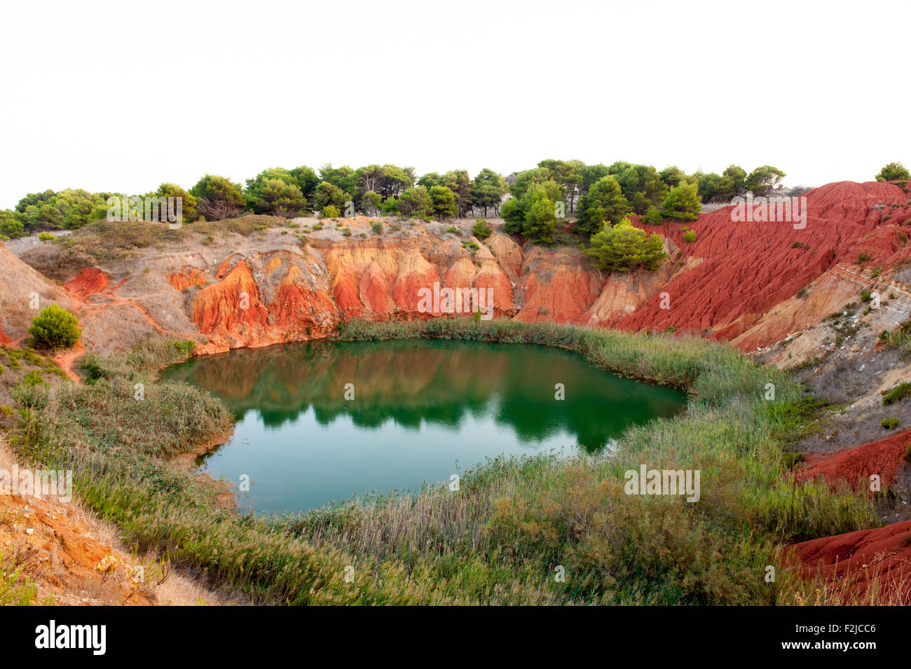 Bauxite mine lake landscape, scenic red colors Stock Photo - Alamy