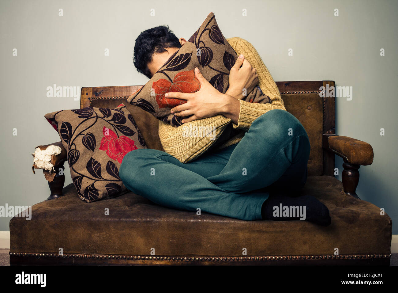 Hiding behind the sofa hi-res stock photography and images - Alamy