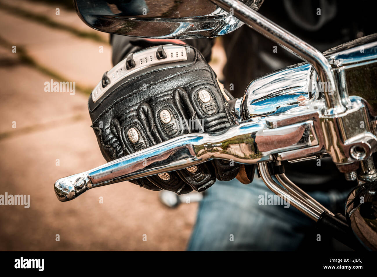 Human hand in a Motorcycle Racing Gloves holds a motorcycle throttle ...