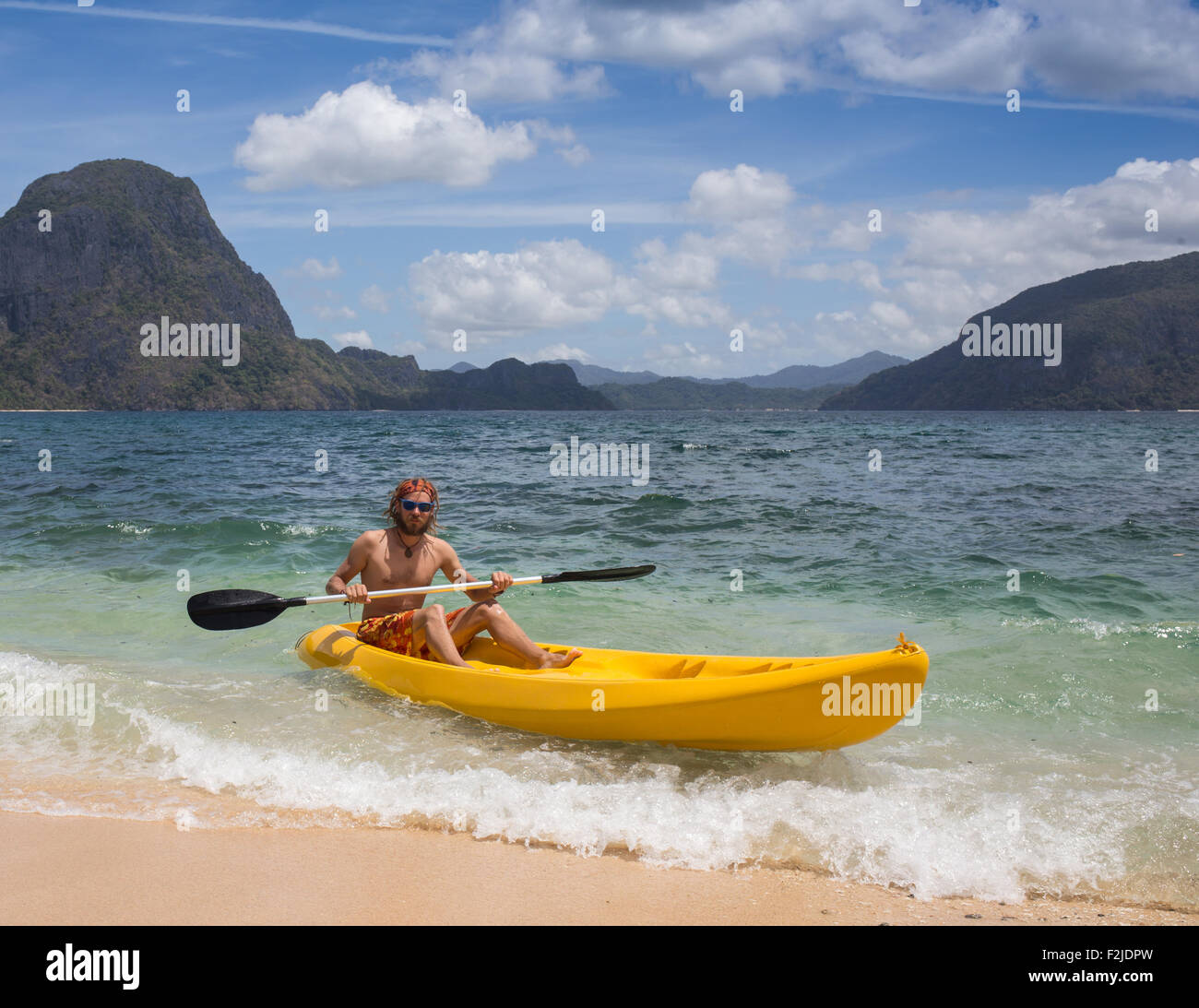 Young people rowing in kayak Stock Photo - Alamy