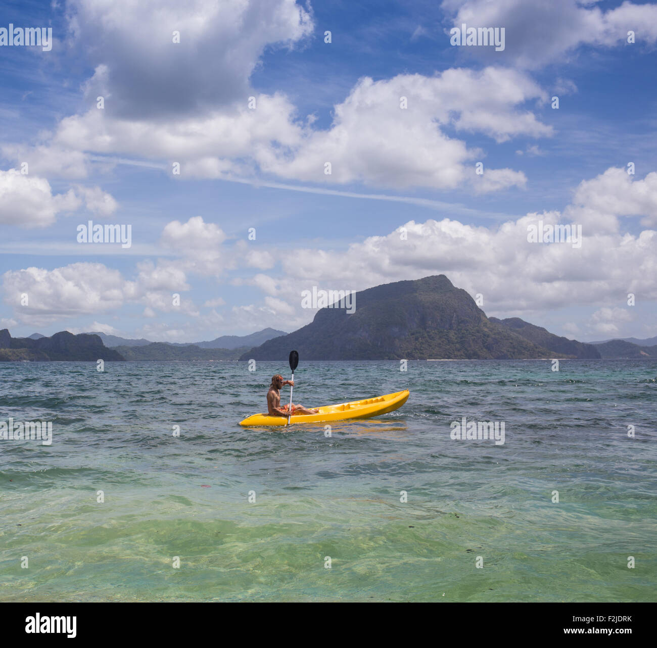 Young people rowing in kayak Stock Photo - Alamy
