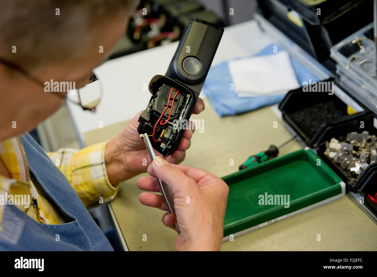 Zirndorf, Germany. 15th Sep, 2015. An employee of Metz mecatech GmbH ...