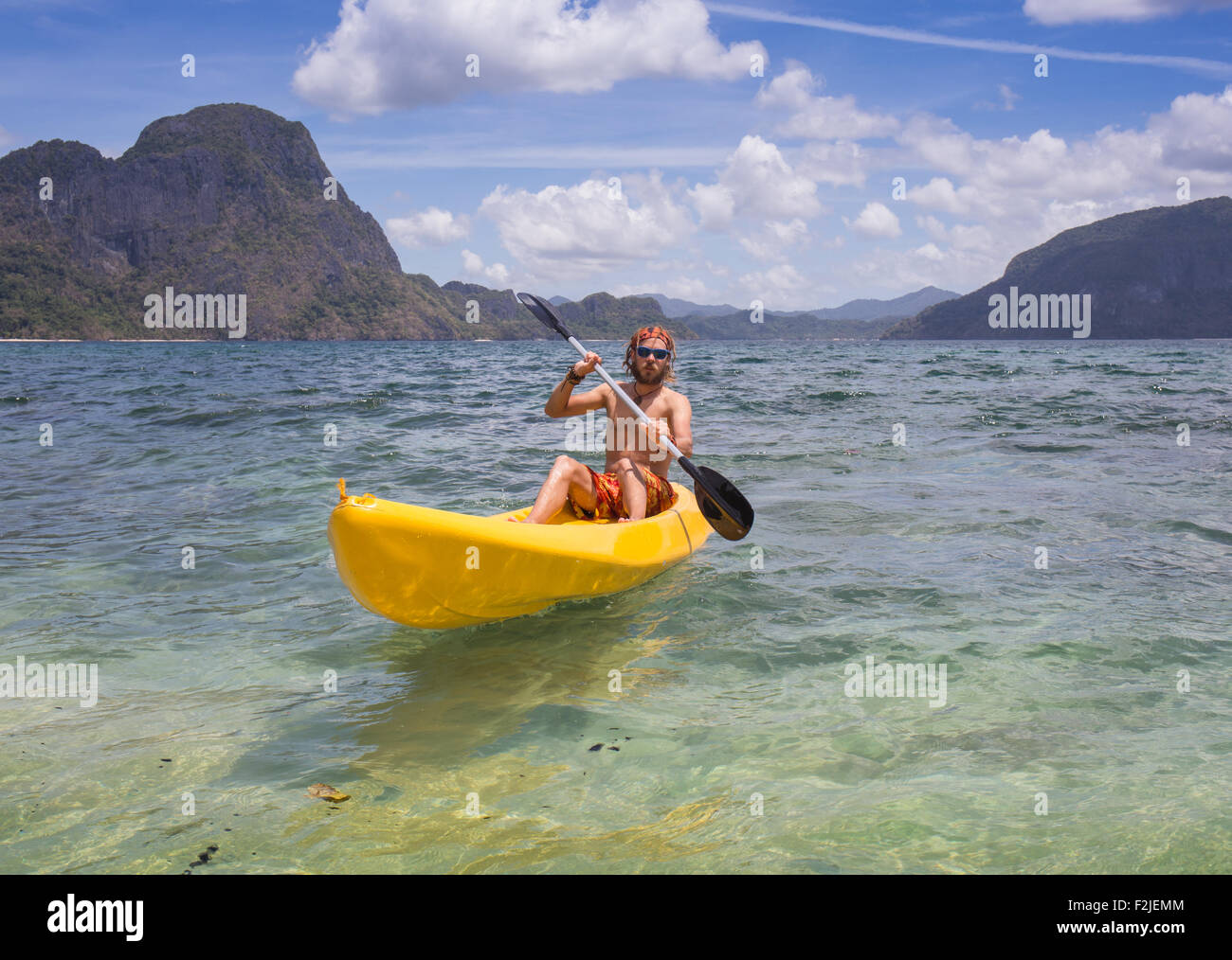 Young people rowing in kayak Stock Photo - Alamy