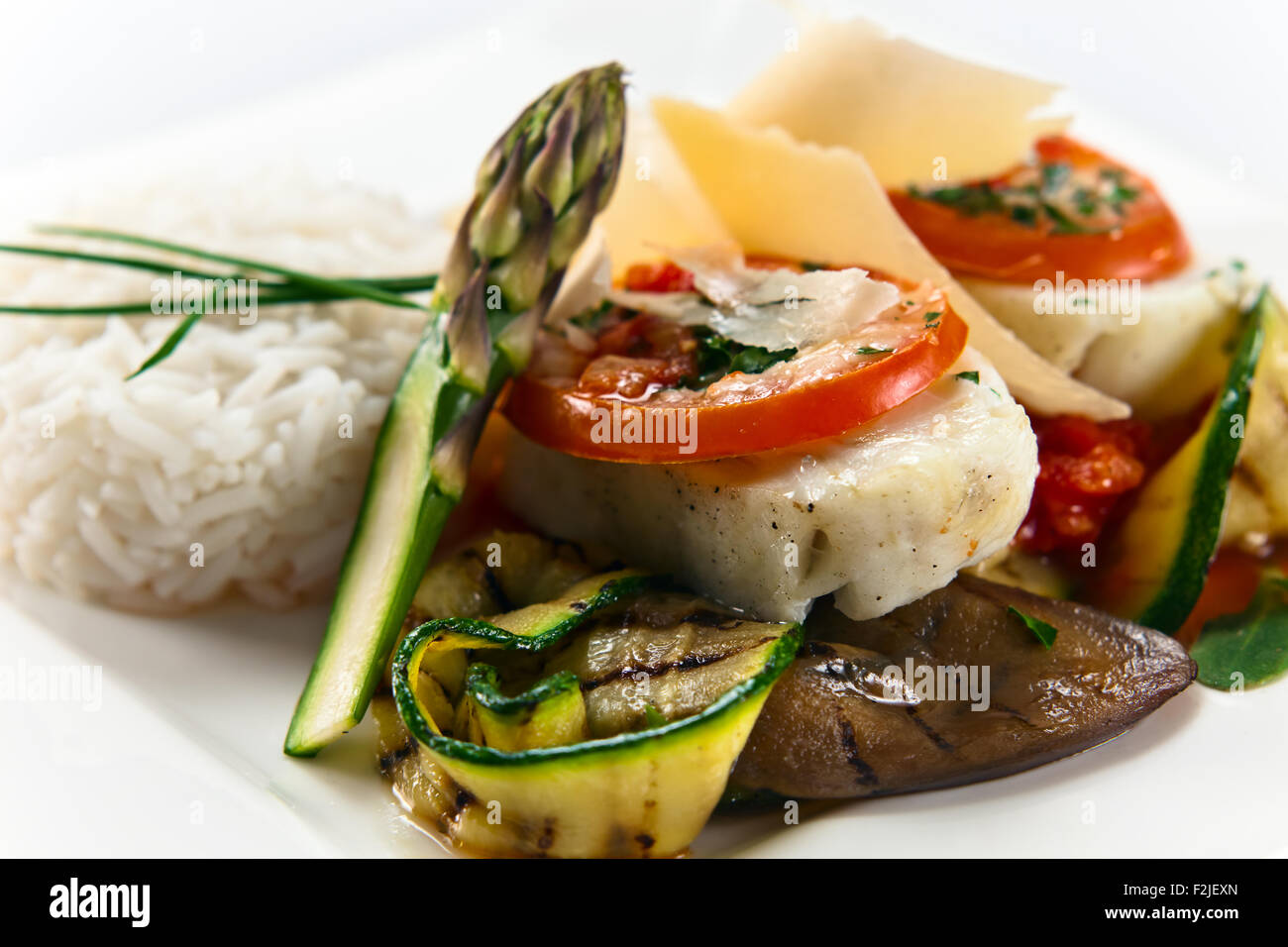 fresh baked halibut with vegetables and spices Stock Photo - Alamy