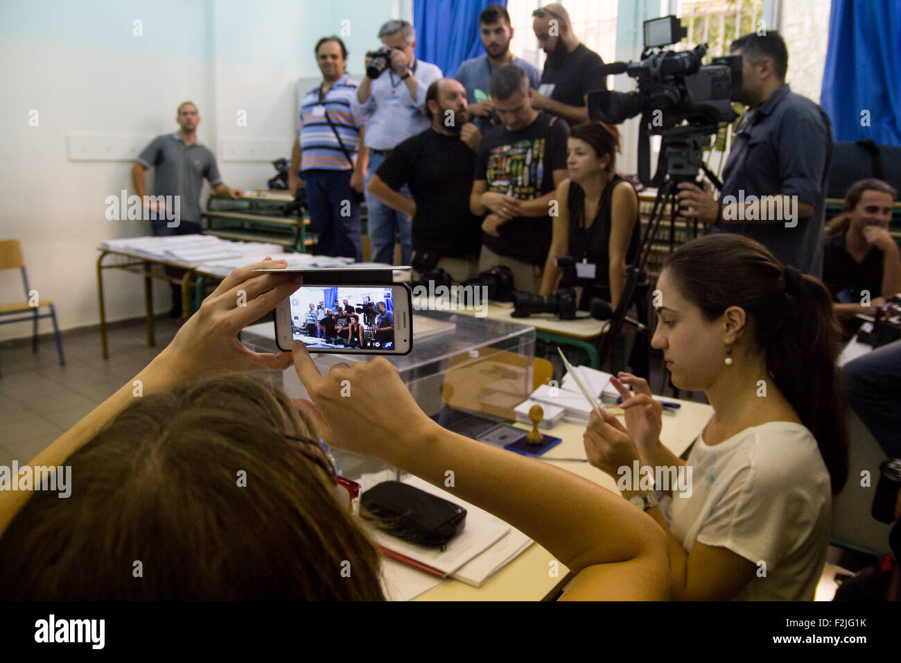 Athens, Greece. 20th Sep, 2015. Members of a voting committee take ...