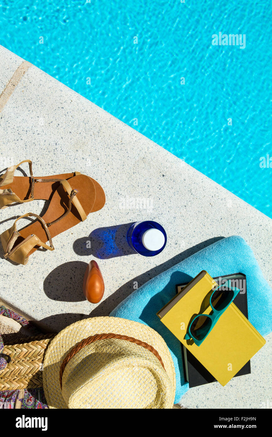 Reading near the swimming pool Stock Photo - Alamy