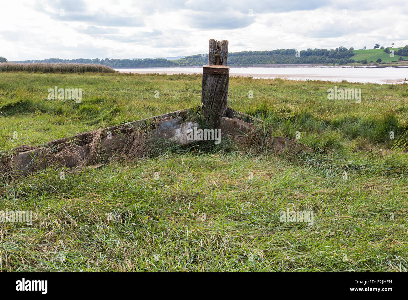 Abandoned boats at Purton ship graveyard on the bank of the river ...