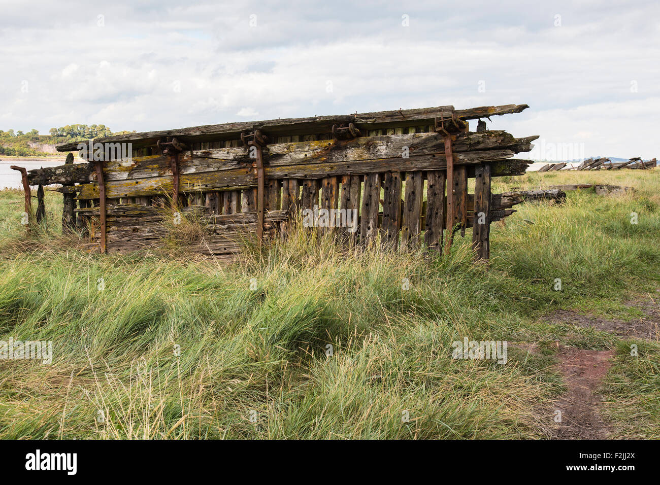 Abandoned boats at Purton ship graveyard on the bank of the river ...