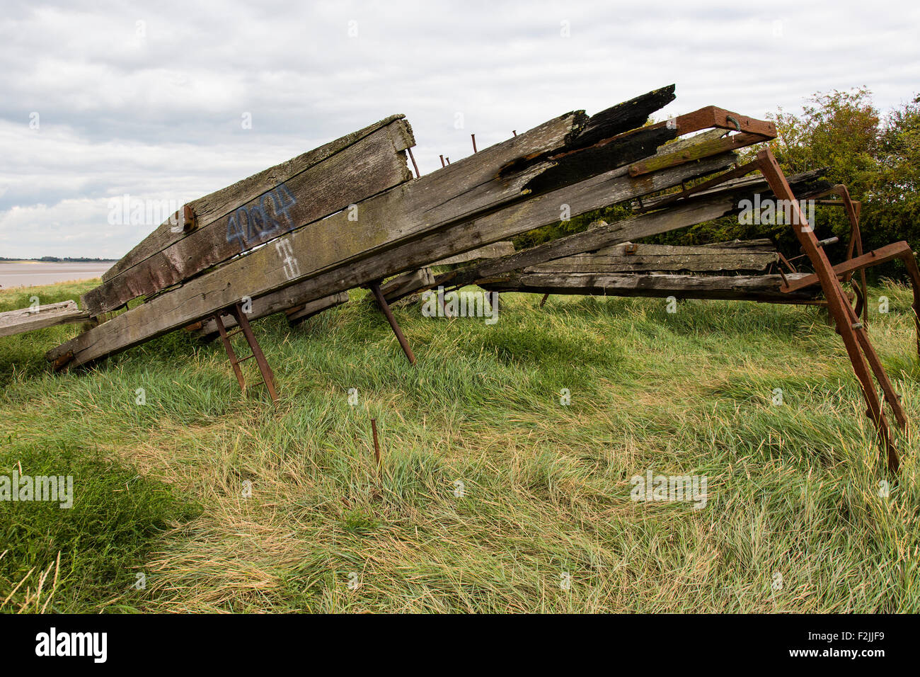 Abandoned boats at Purton ship graveyard on the bank of the river ...