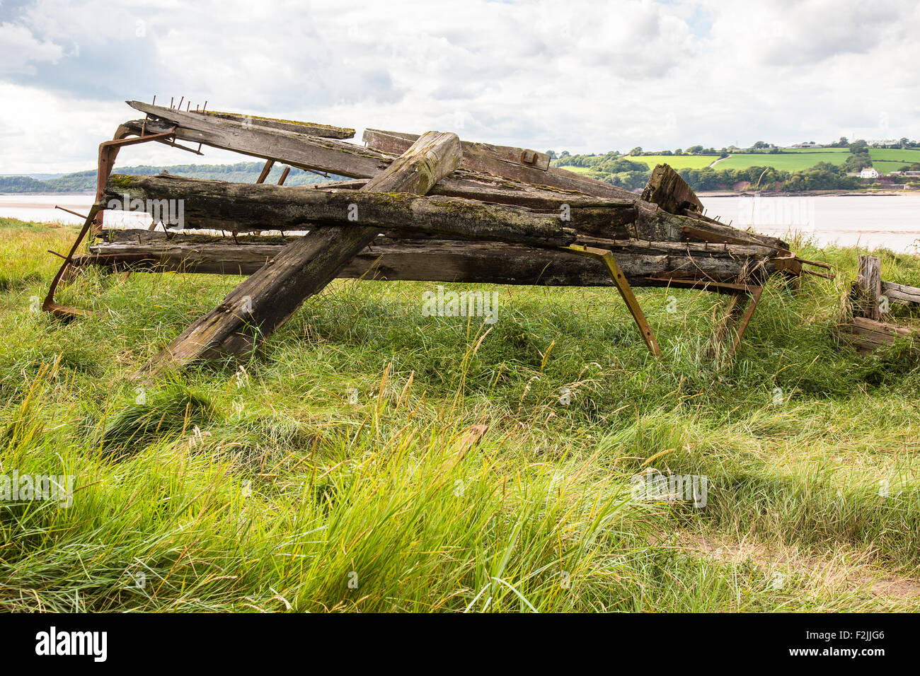 Abandoned boats at Purton ship graveyard on the bank of the river ...