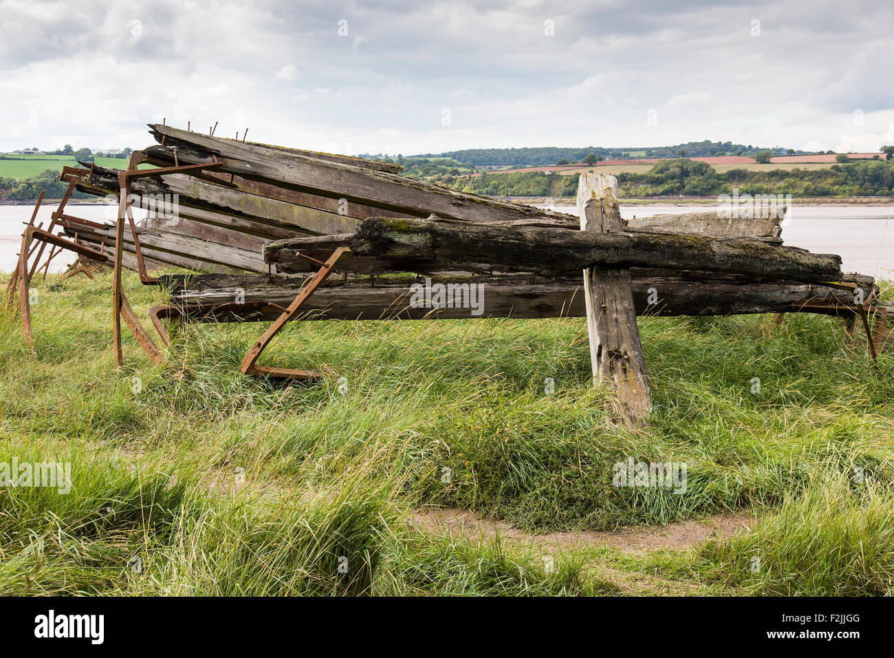 Abandoned boats at Purton ship graveyard on the bank of the river ...