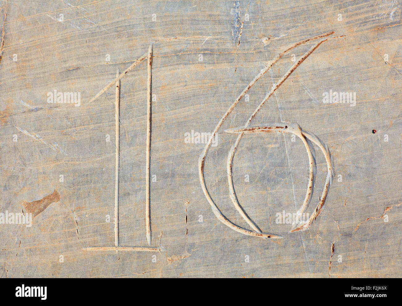 Photo of Numbers sixteen etched in stone Stock Photo - Alamy