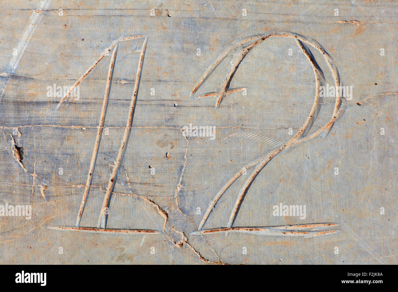 Photo of Numbers twelve etched in stone Stock Photo - Alamy