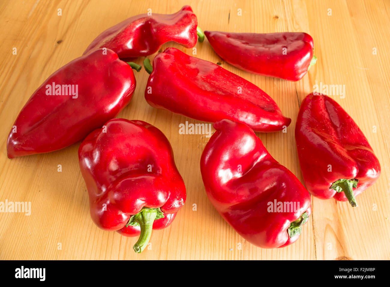 Red peppers on the plank table Stock Photo - Alamy