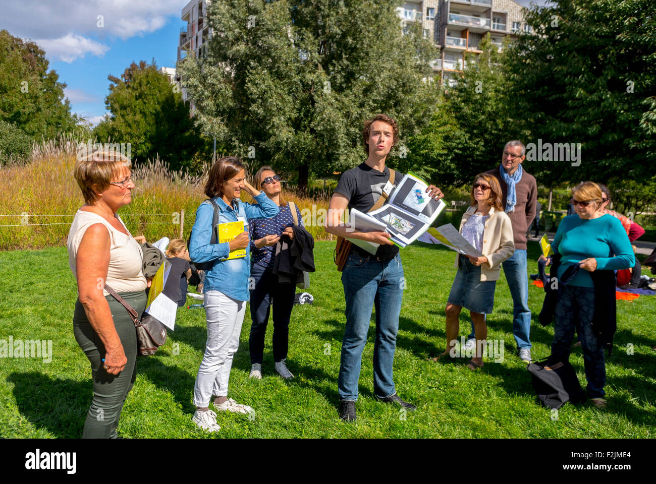 Paris, France, Tour Guide leading groups Speaking to French Tourists ...
