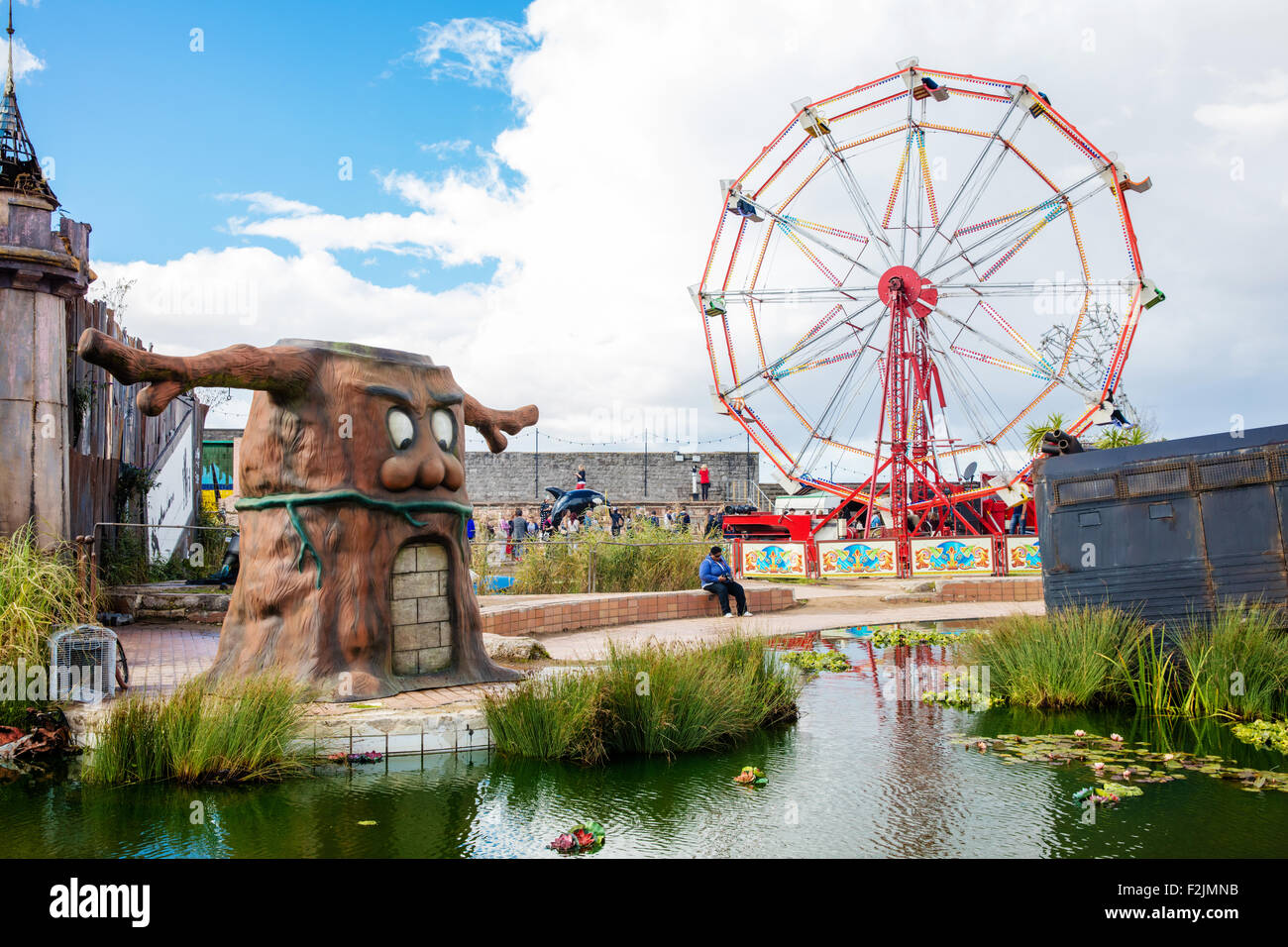 View across the lake at Banksy's Dismaland in Weston super Mare with ...