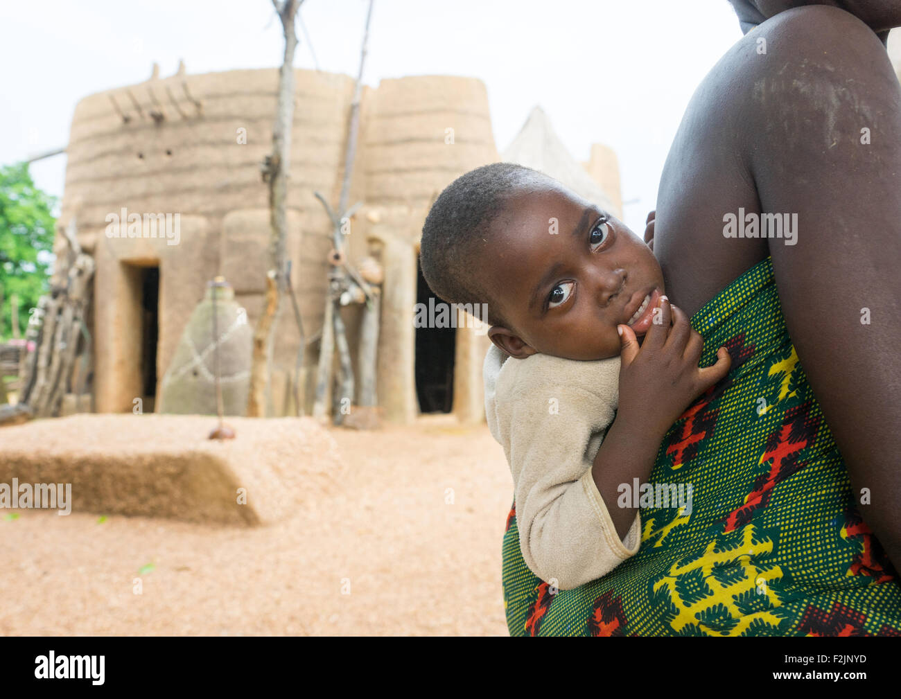Benin, West Africa, Boukoumbé, baby in front of a traditional tata ...