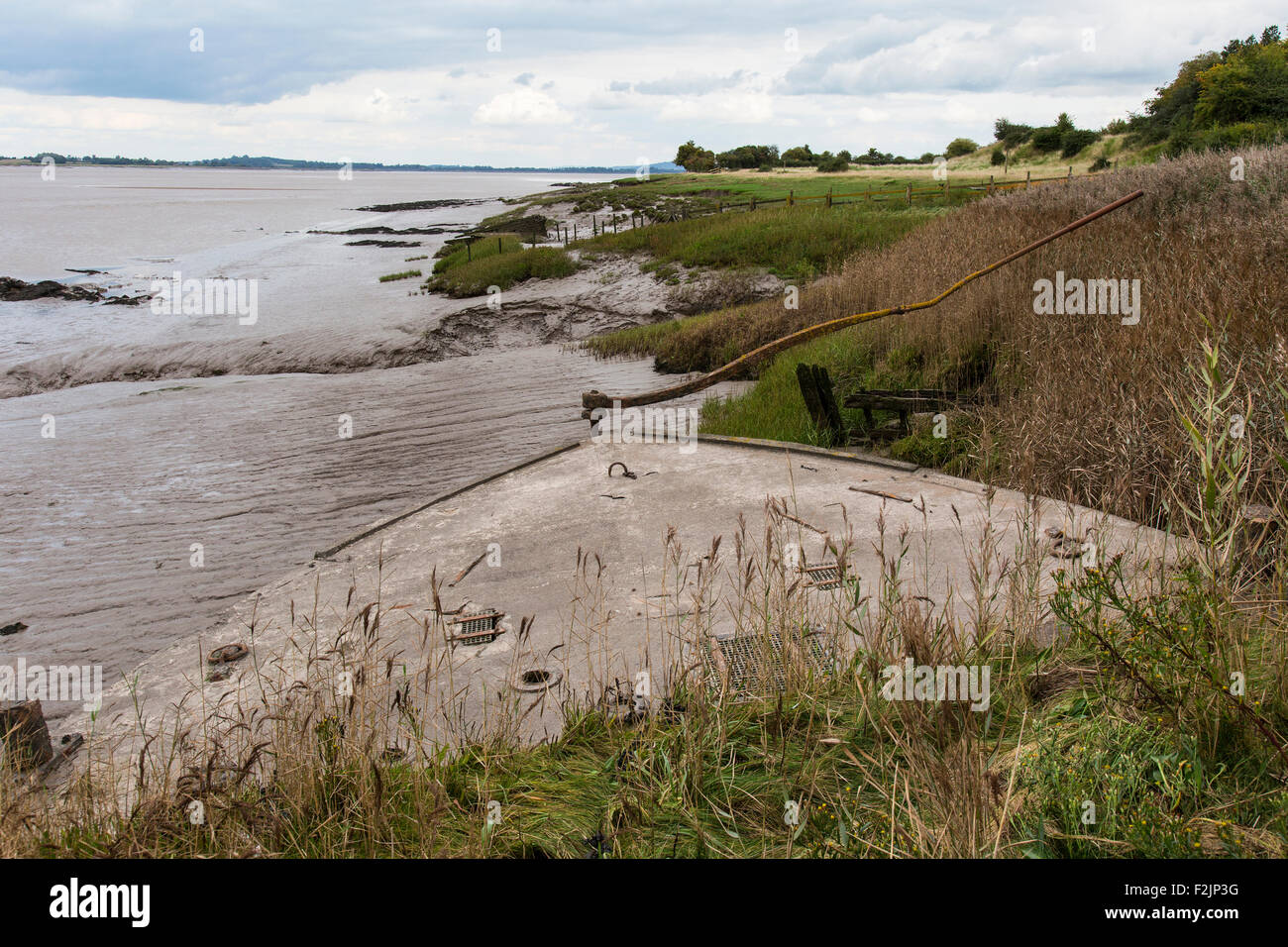 Abandoned boats at Purton ship graveyard on the bank of the river ...