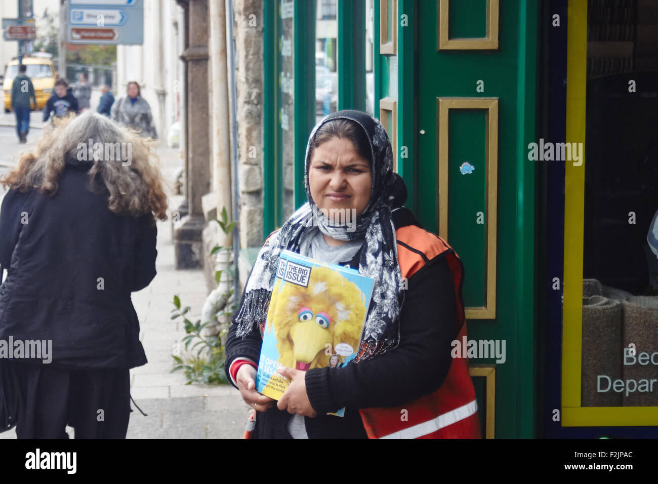 Romanian Big Issue seller in Devon Stock Photo - Alamy