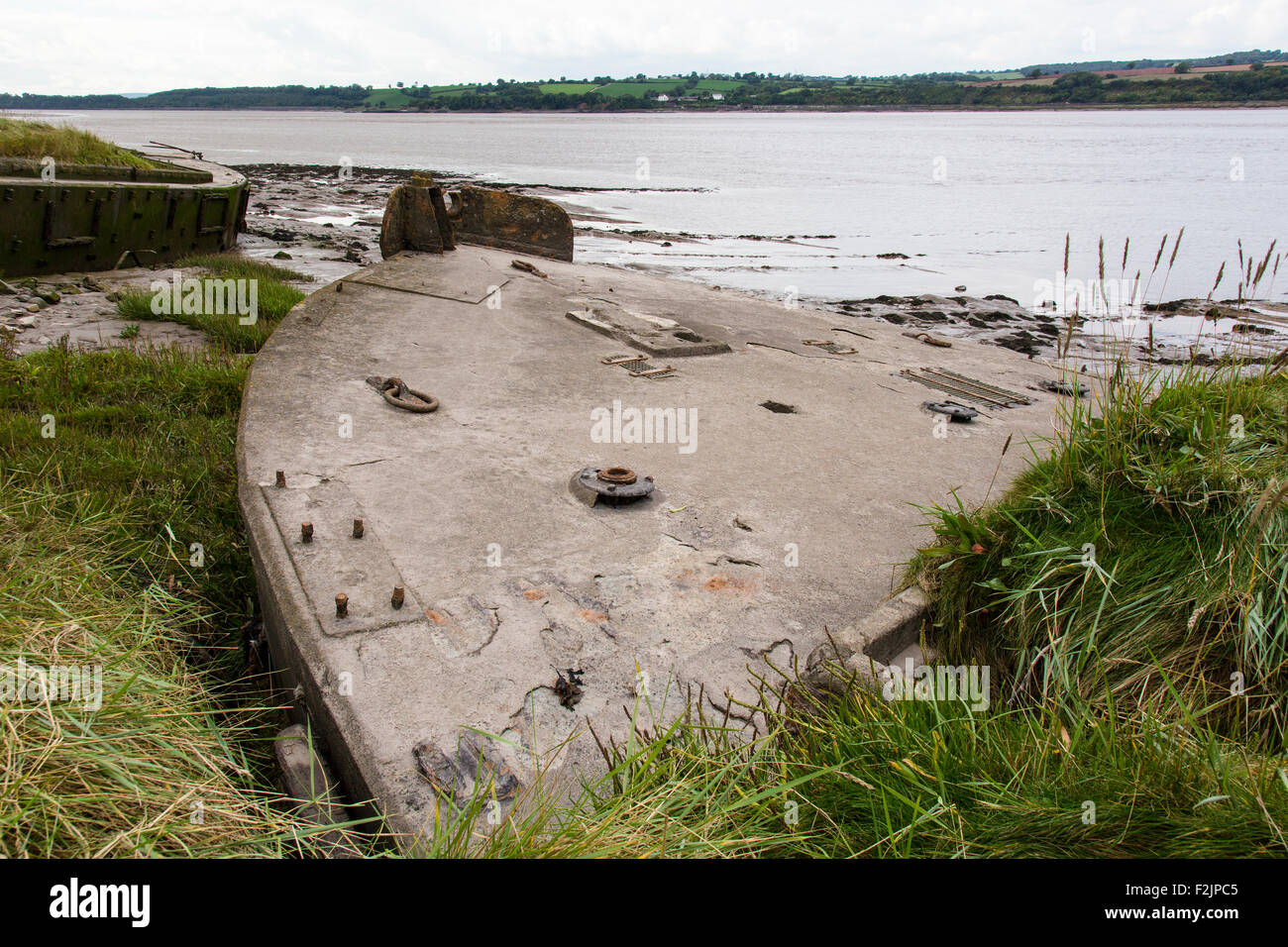 Abandoned boats at Purton ship graveyard on the bank of the river ...