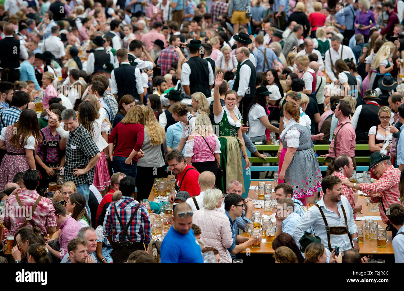 Munich, Germany. 20th Sep, 2015. Visitors enjoy themselves in a beer ...
