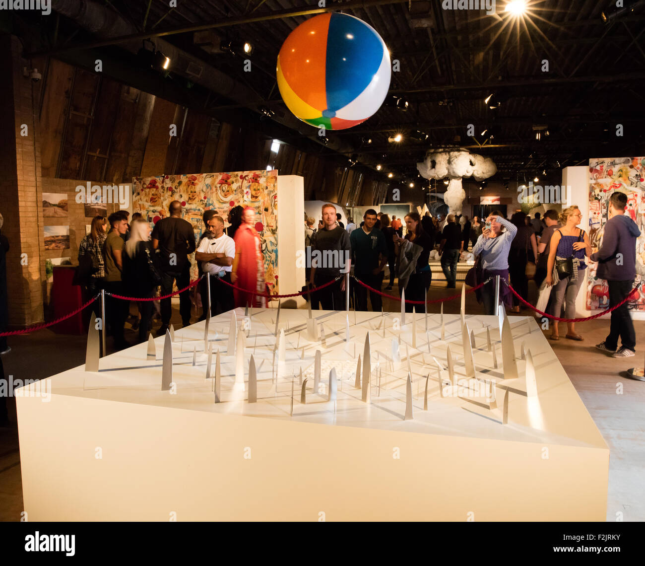 A sculptural art installation featuring a ball floating on air above a ...