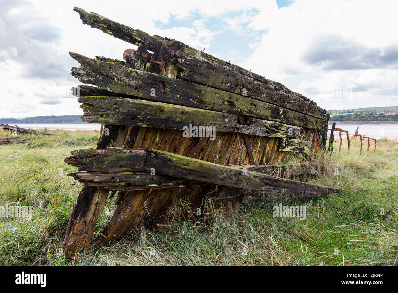 Abandoned boats at Purton ship graveyard on the bank of the river ...