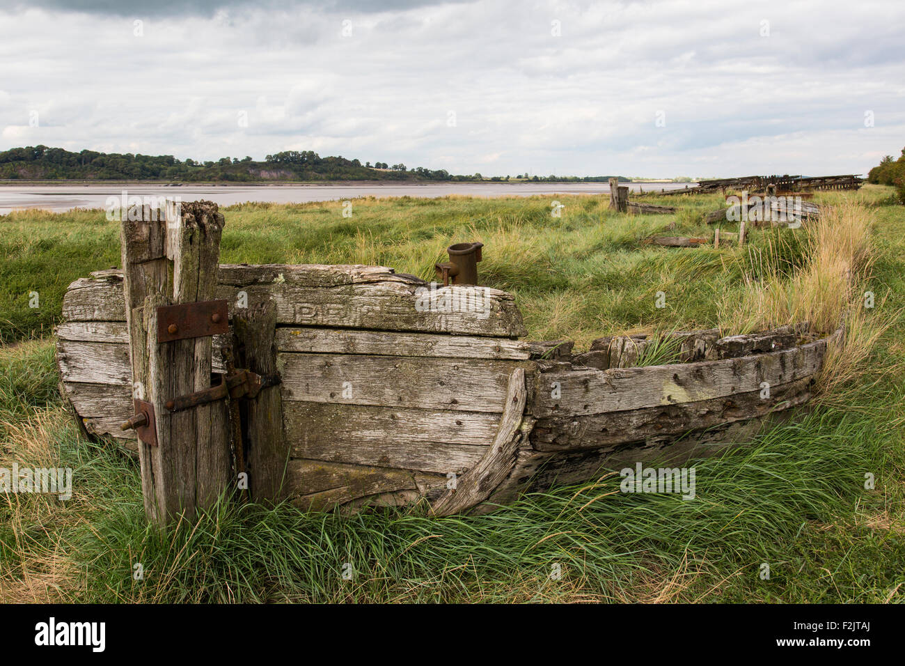 Abandoned boats at Purton ship graveyard on the bank of the river ...