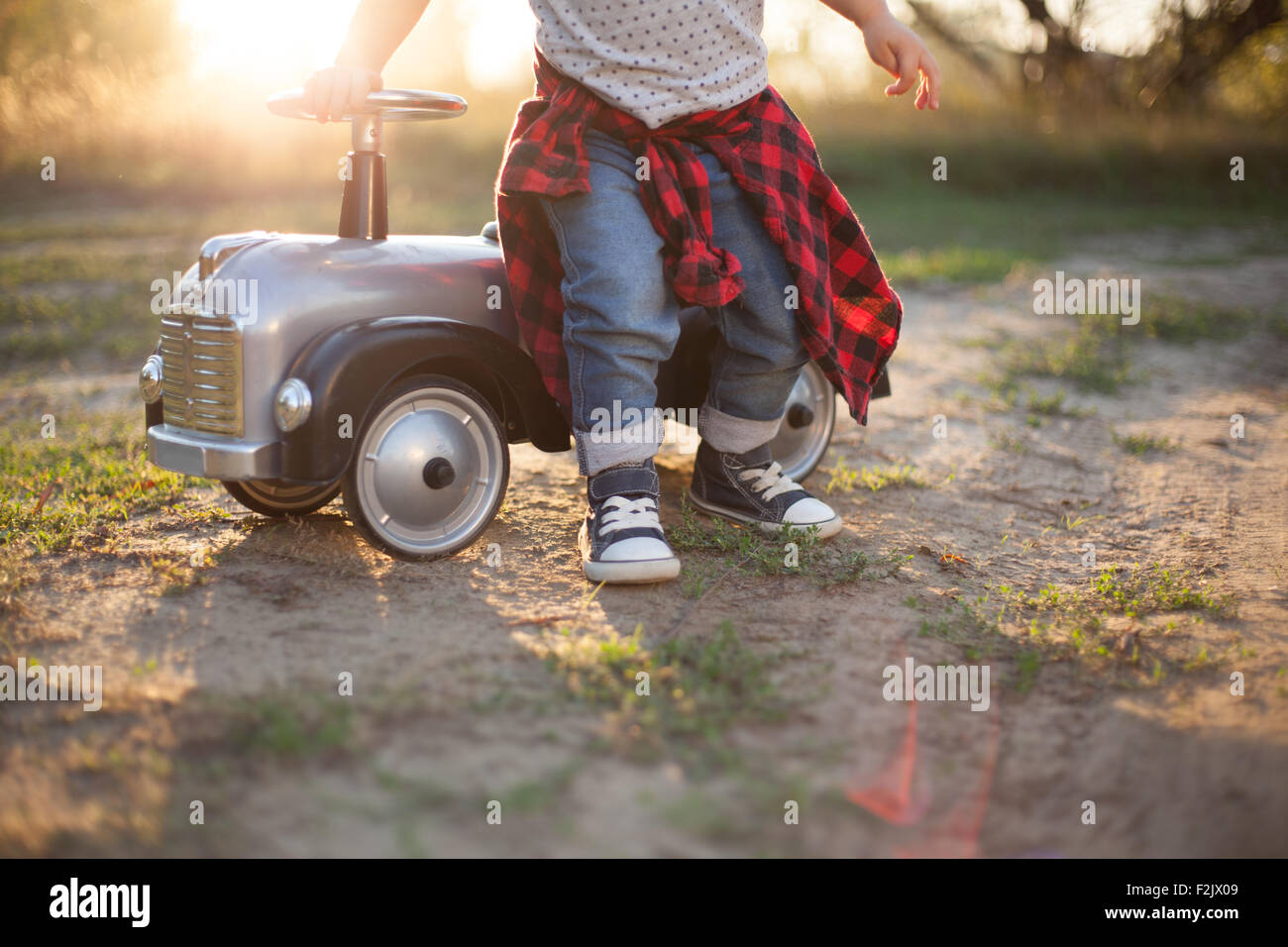 Little racer and tiny race car Stock Photo - Alamy