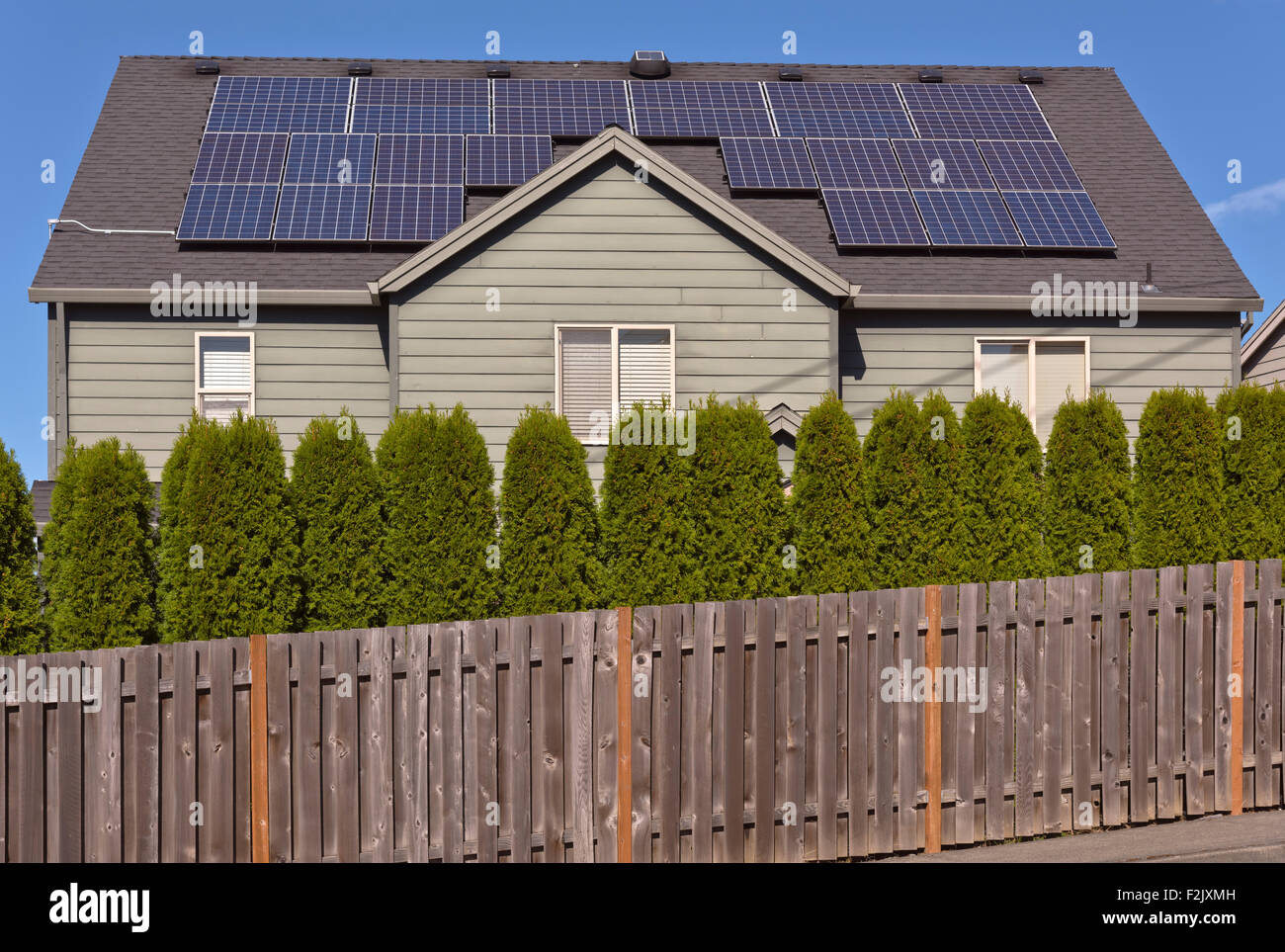 Solar panels facing the sun on a roof of a house Stock Photo - Alamy