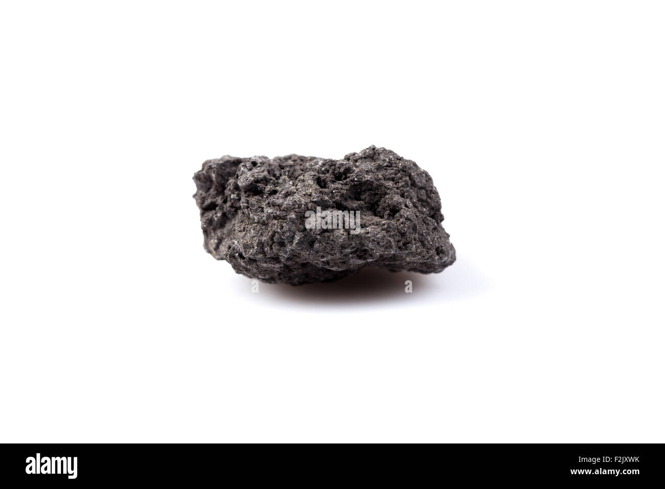 Black lava rock from volcano on a white background Stock Photo - Alamy